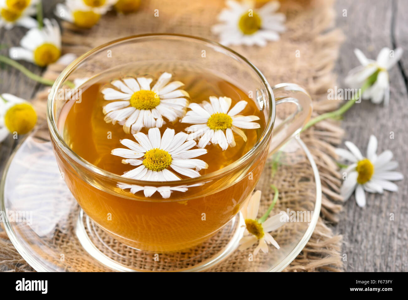 Chamomile tea in glass cup, close up view Stock Photo - Alamy