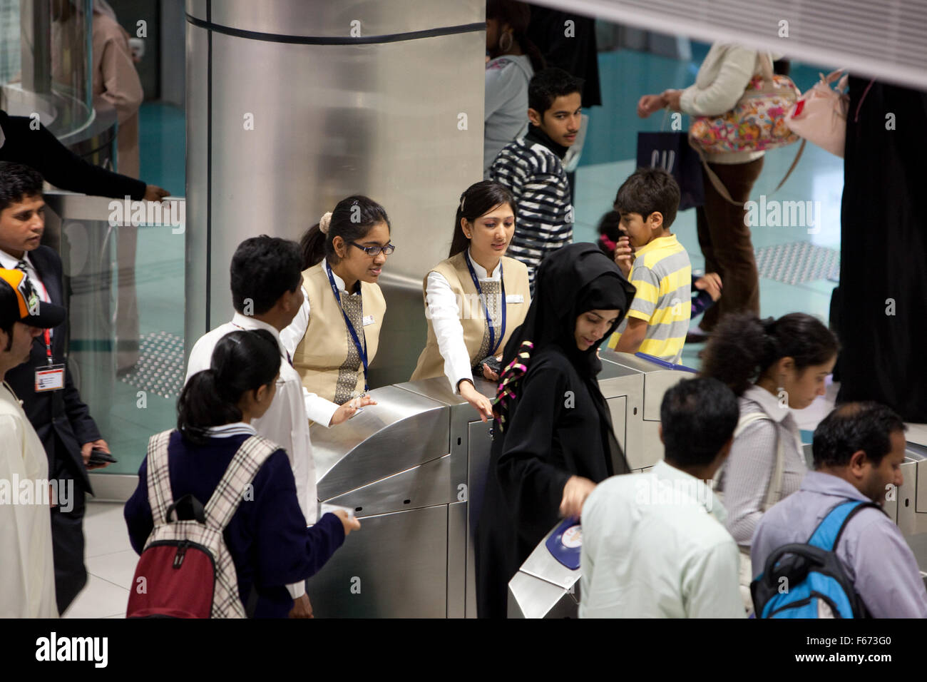 Dubai Metro station staff attending to the public Stock Photo - Alamy