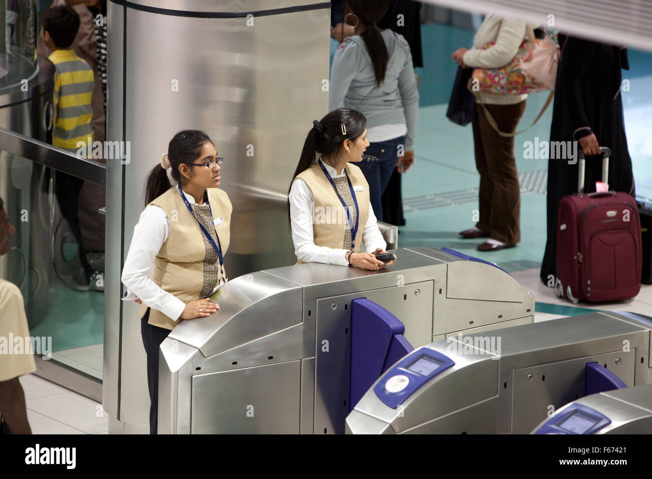 Dubai Metro station staff attending to the public Stock Photo - Alamy