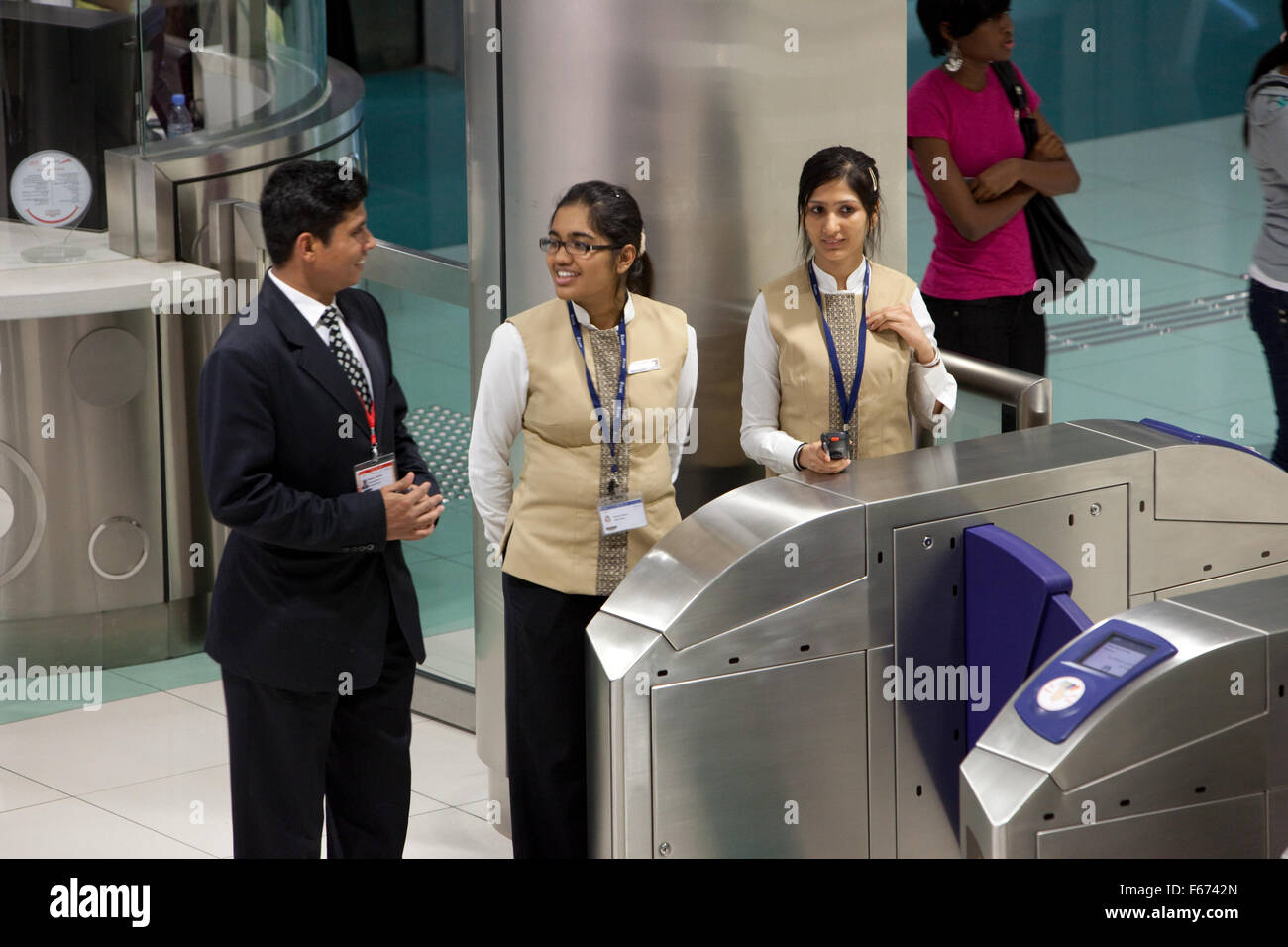 Dubai Metro station staff attending to the public Stock Photo - Alamy