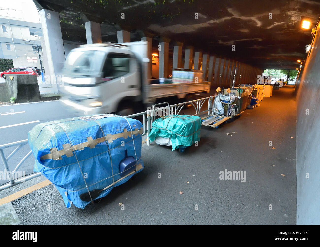 Tokyo, Japan. 12th Nov, 2015. A Japanese homeless encampment under a ...
