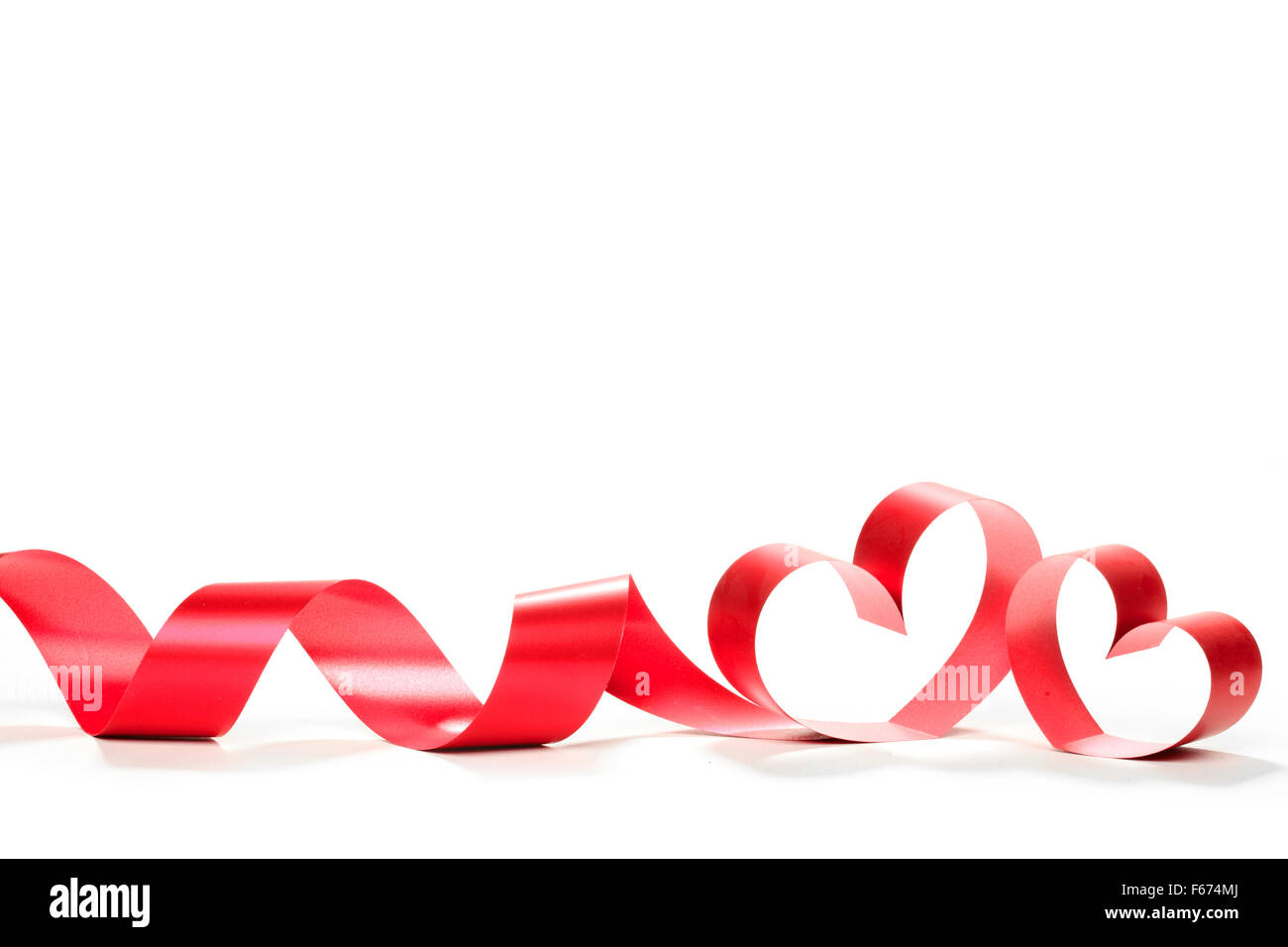 red heart ribbon isolated on white background Stock Photo - Alamy
