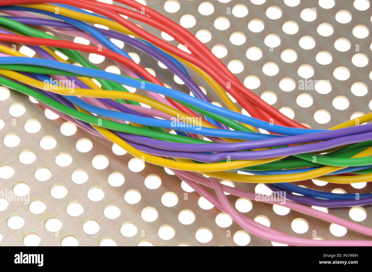 Colored electrical cables on metal surface Stock Photo - Alamy