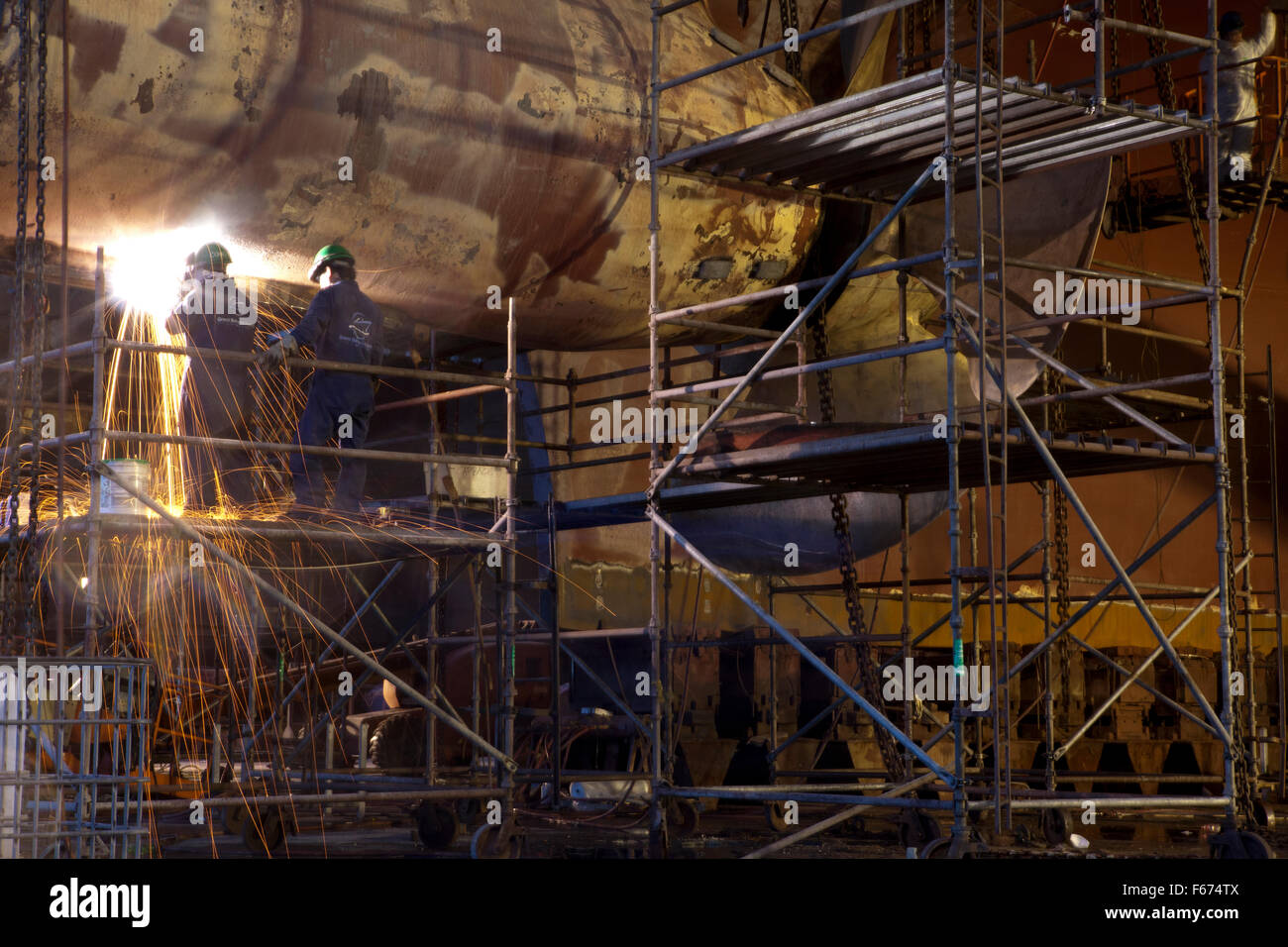 Men at work during dry dock Stock Photo - Alamy