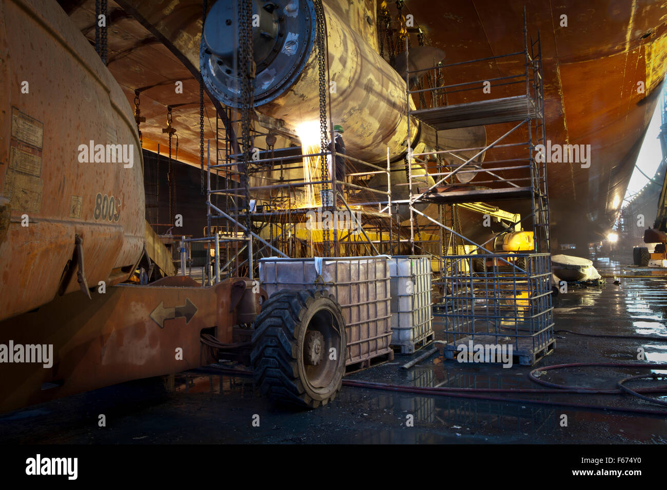 Men at work during dry dock Stock Photo - Alamy