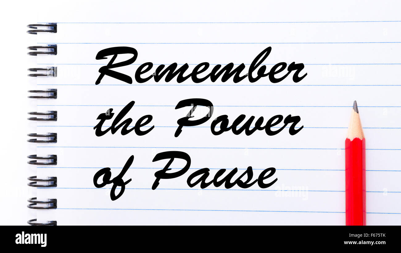 Remember the Power of Pause written on notebook page, red pencil on the ...
