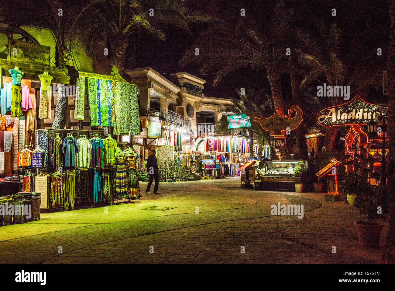 Main street of souvenir shops and restaurants at night in Dahab, Egypt ...