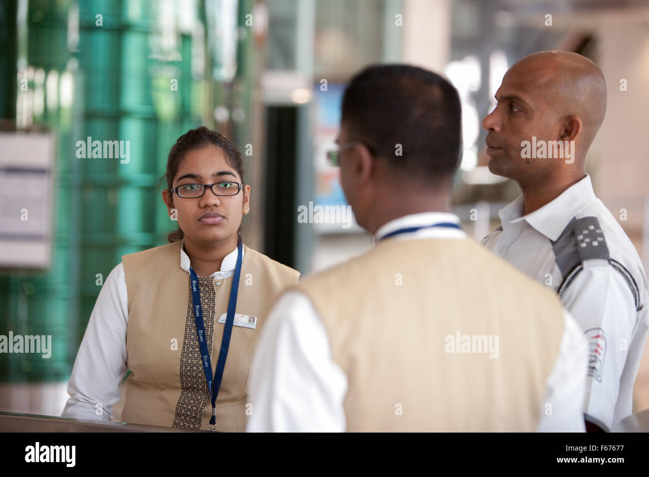 Staff of the Dubai Metro assisting the public Stock Photo - Alamy