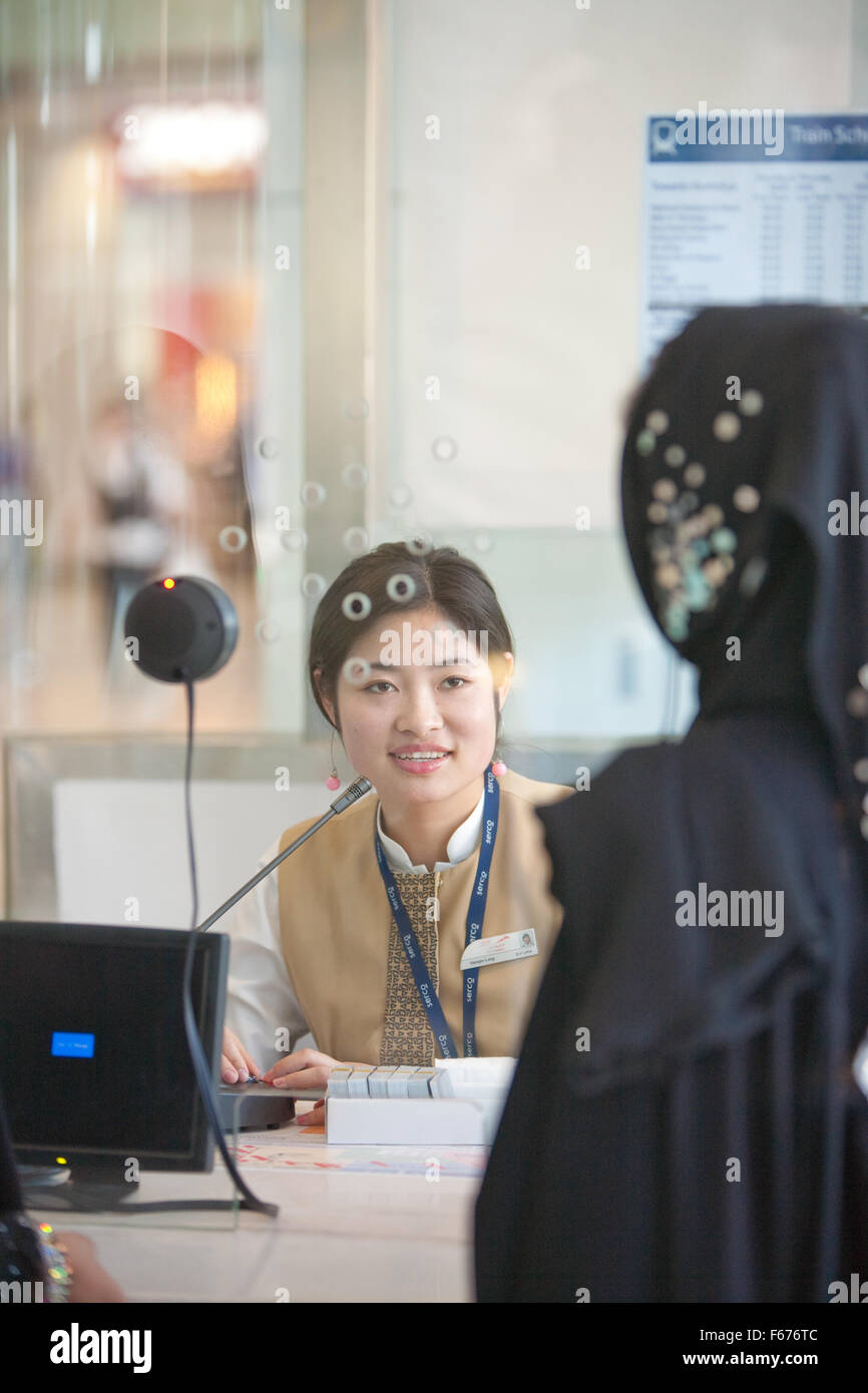 Staff of the Dubai Metro assisting the public Stock Photo - Alamy