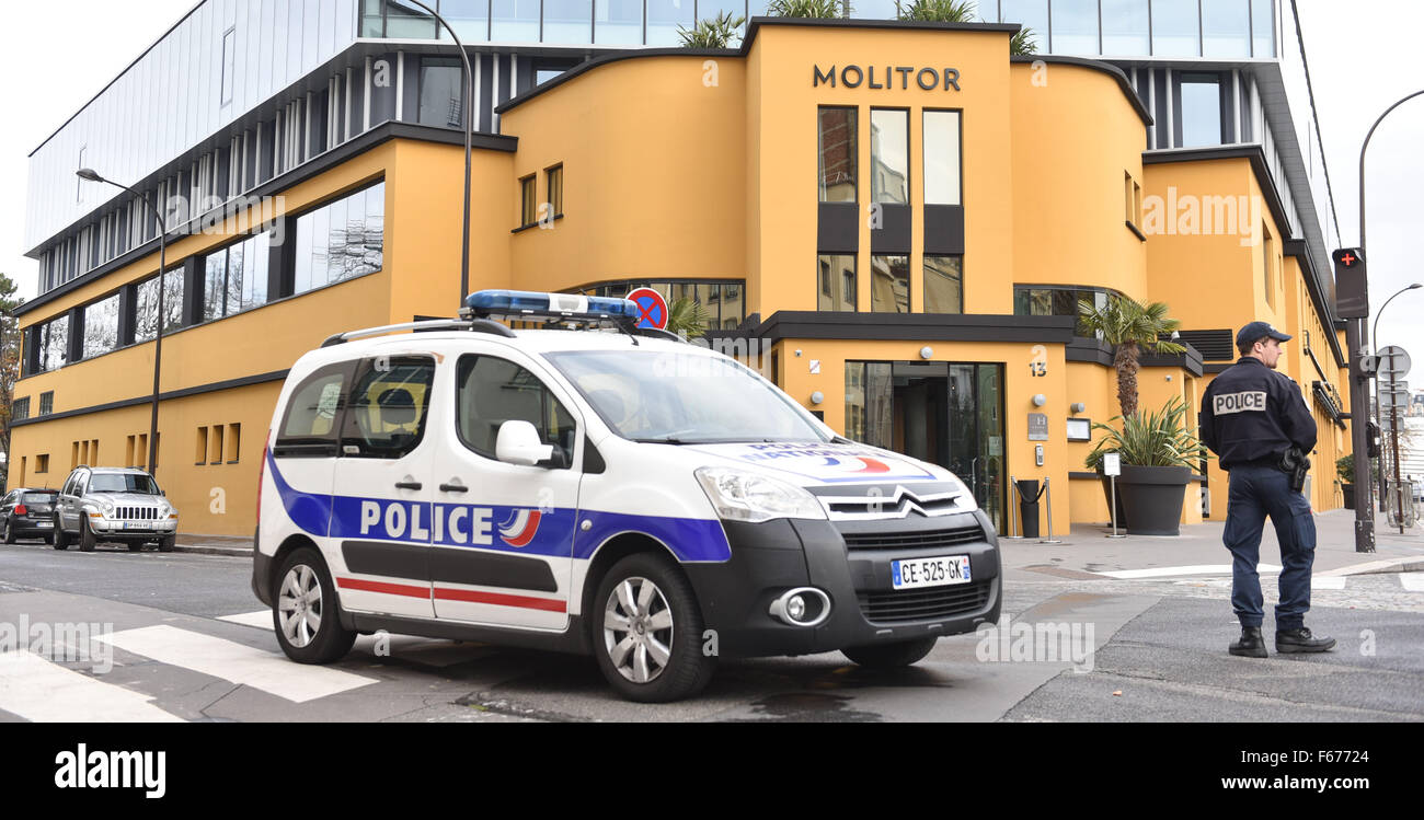 Paris, France. 13th Nov, 2015. A police car and police officer stand in ...