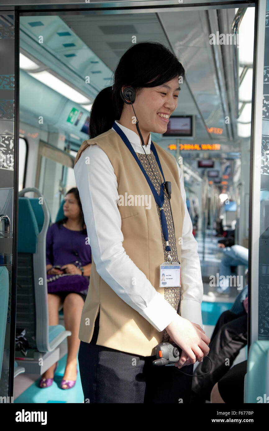 Staff assistance in the Dubai Metro Stock Photo - Alamy