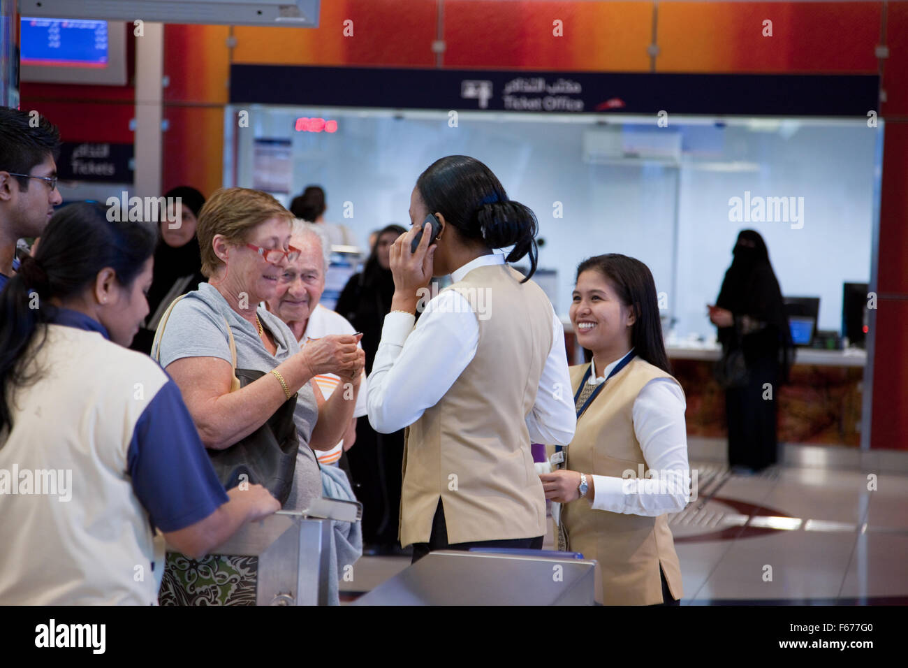 Staff assistance in the Dubai Metro Stock Photo - Alamy