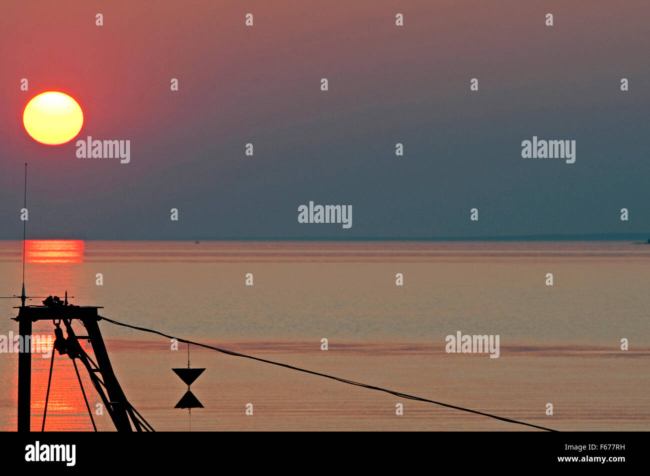 sunset on the horizon above sea Stock Photo - Alamy
