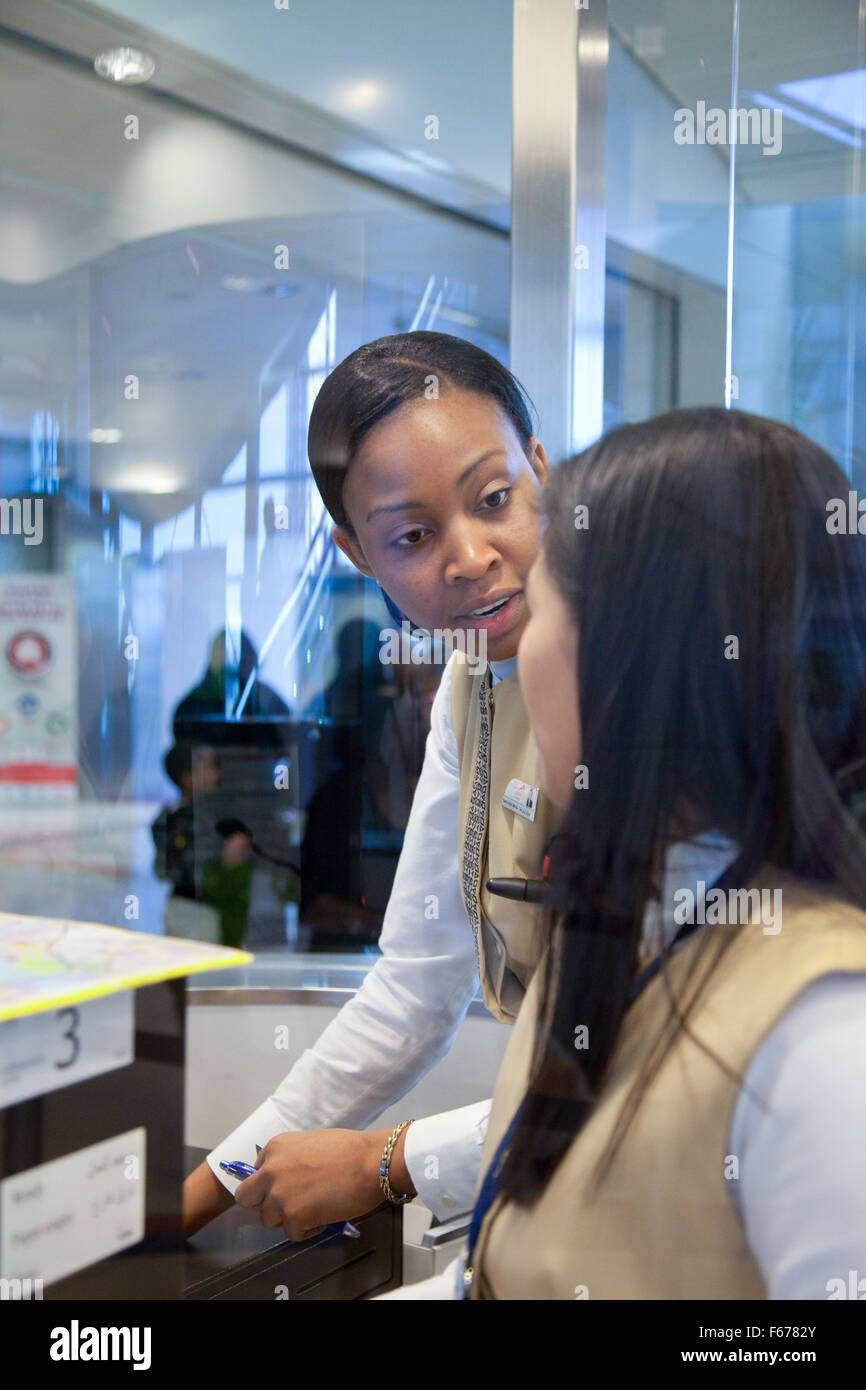 Ticket sales office staff in the Dubai Metro Stock Photo - Alamy
