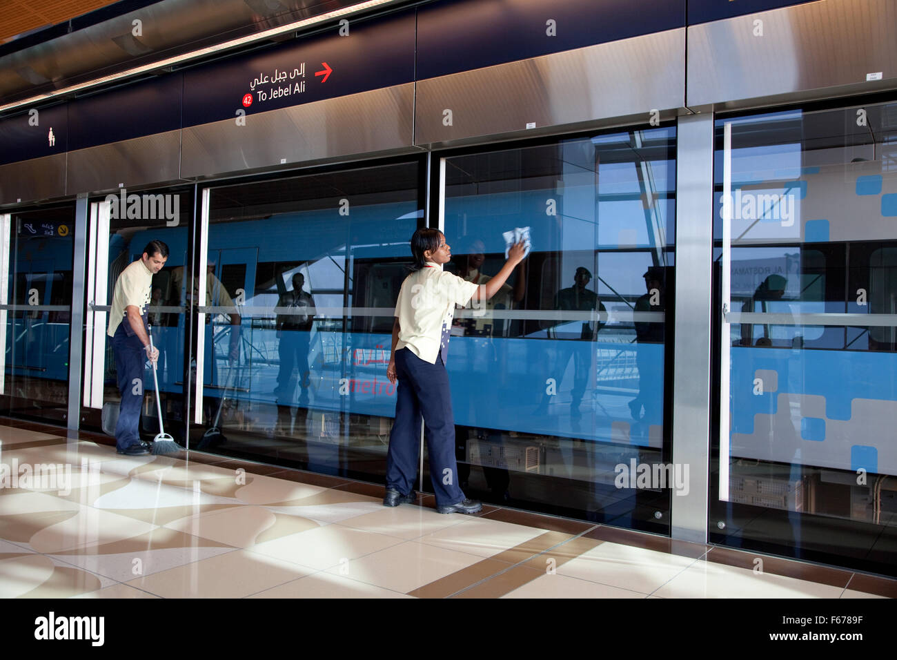 Dubai Metro cleaning staff Stock Photo - Alamy