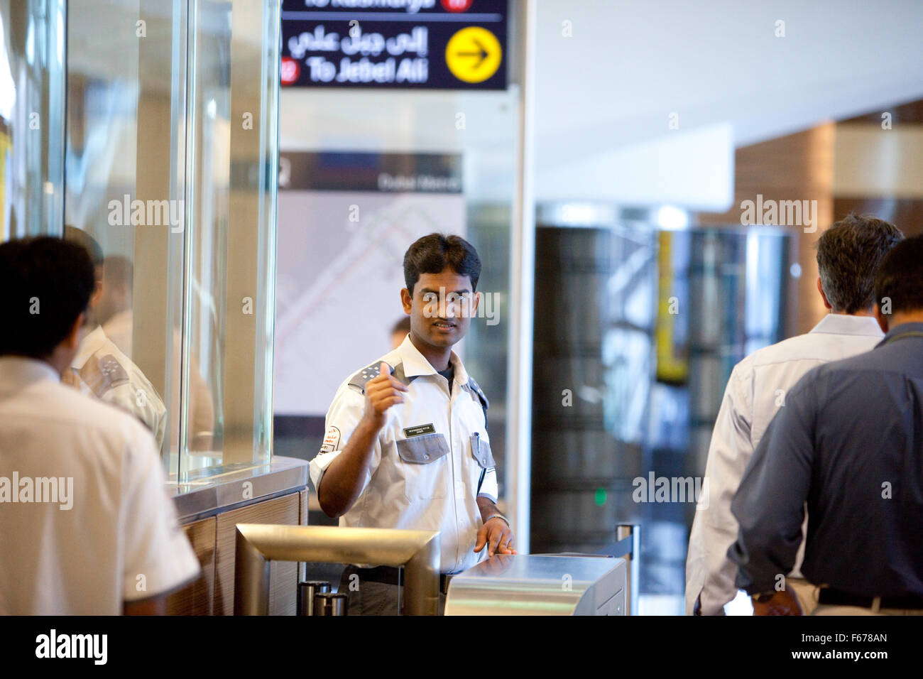 Ticket sales office staff in the Dubai Metro Stock Photo - Alamy