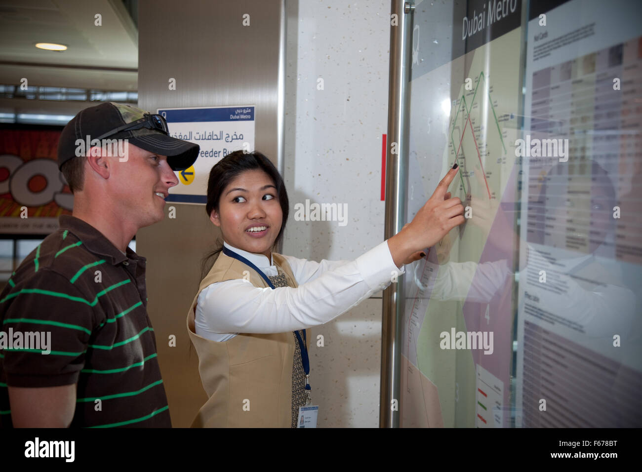 Staff assistance in the Dubai Metro Stock Photo - Alamy