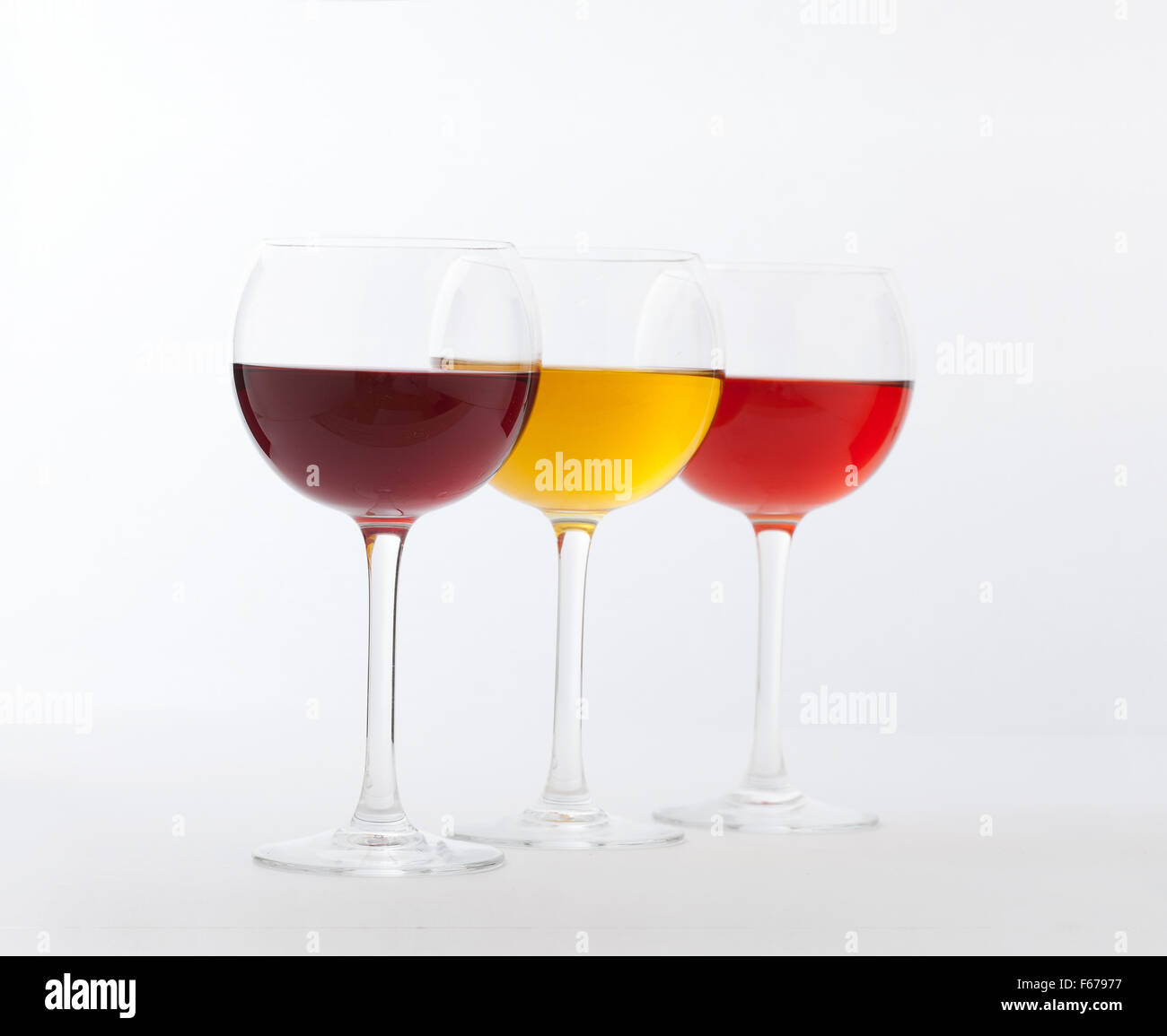 Wine bar, three glasses of wine unusual perspective on white background ...
