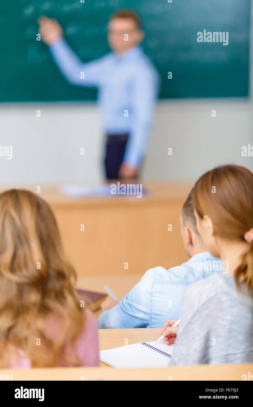 College professor is explaining lecture material Stock Photo - Alamy