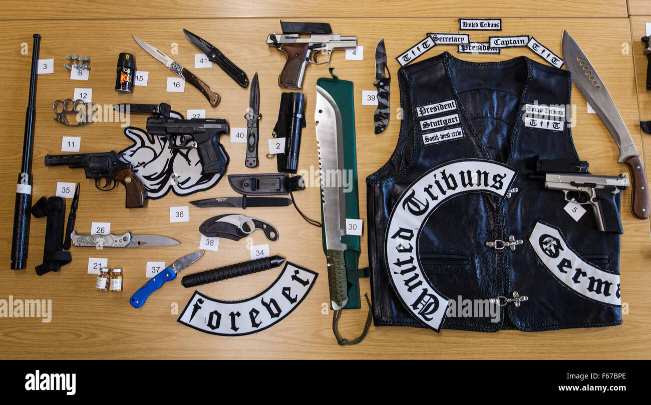 Numerous confiscated weapons and other items on a table at the police ...