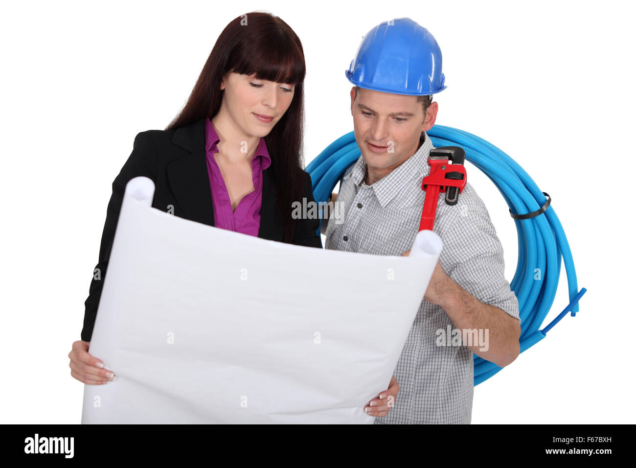 Female construction worker reading blueprints hi-res stock photography ...