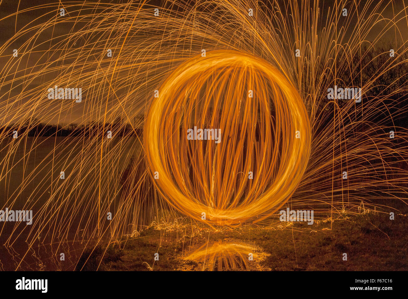 spinning with fire and light Stock Photo - Alamy