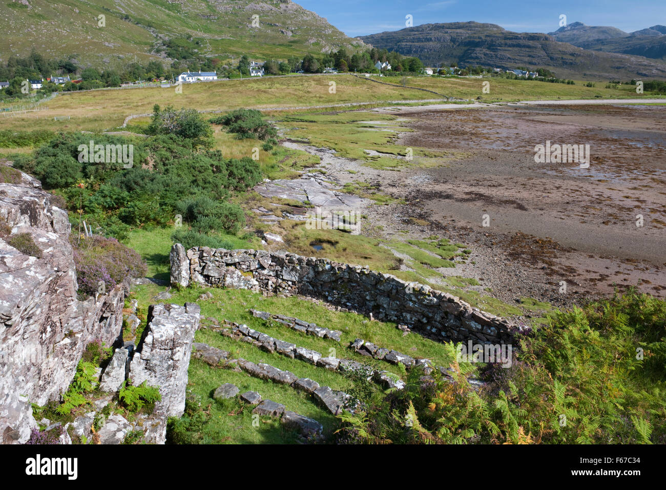 View E over stone pulpit, seating, entrance & enclosure wall of Am Ploc ...