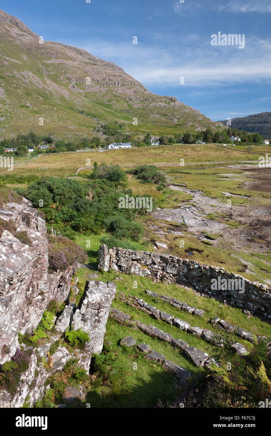 View E over stone pulpit, seating, entrance & enclosure wall of Am Ploc ...