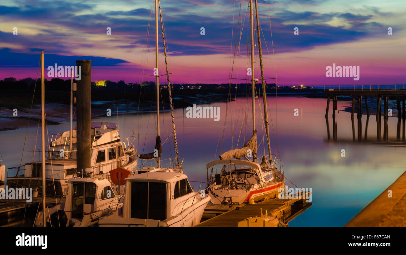 Sail boats docked on marine in beautiful sunset sky, horizontal photo ...