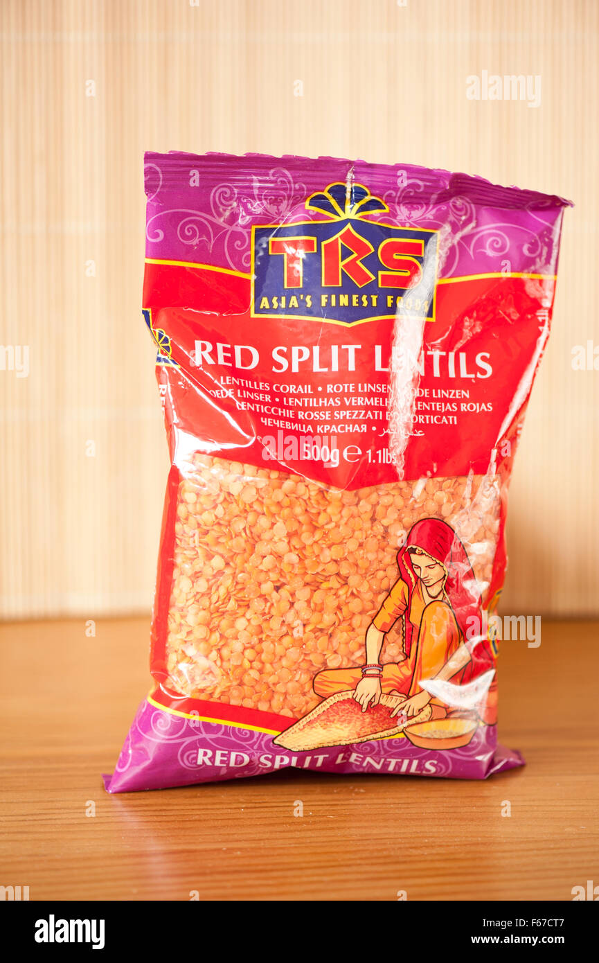 Red split lentils product in 500g plastic partially transparent pack ...