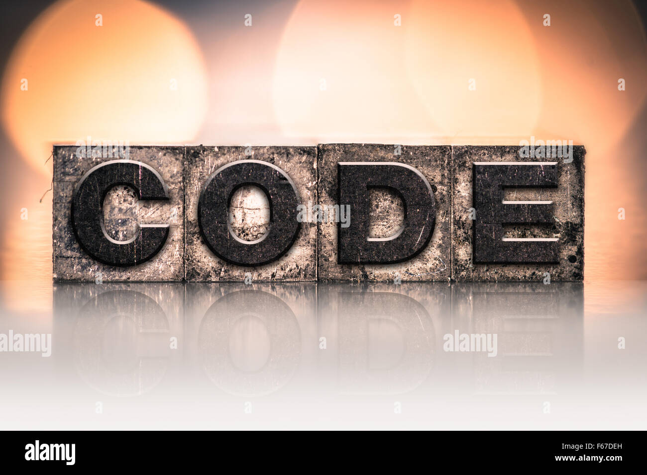 The word "CODE" written in vintage ink stained letterpress type Stock ...