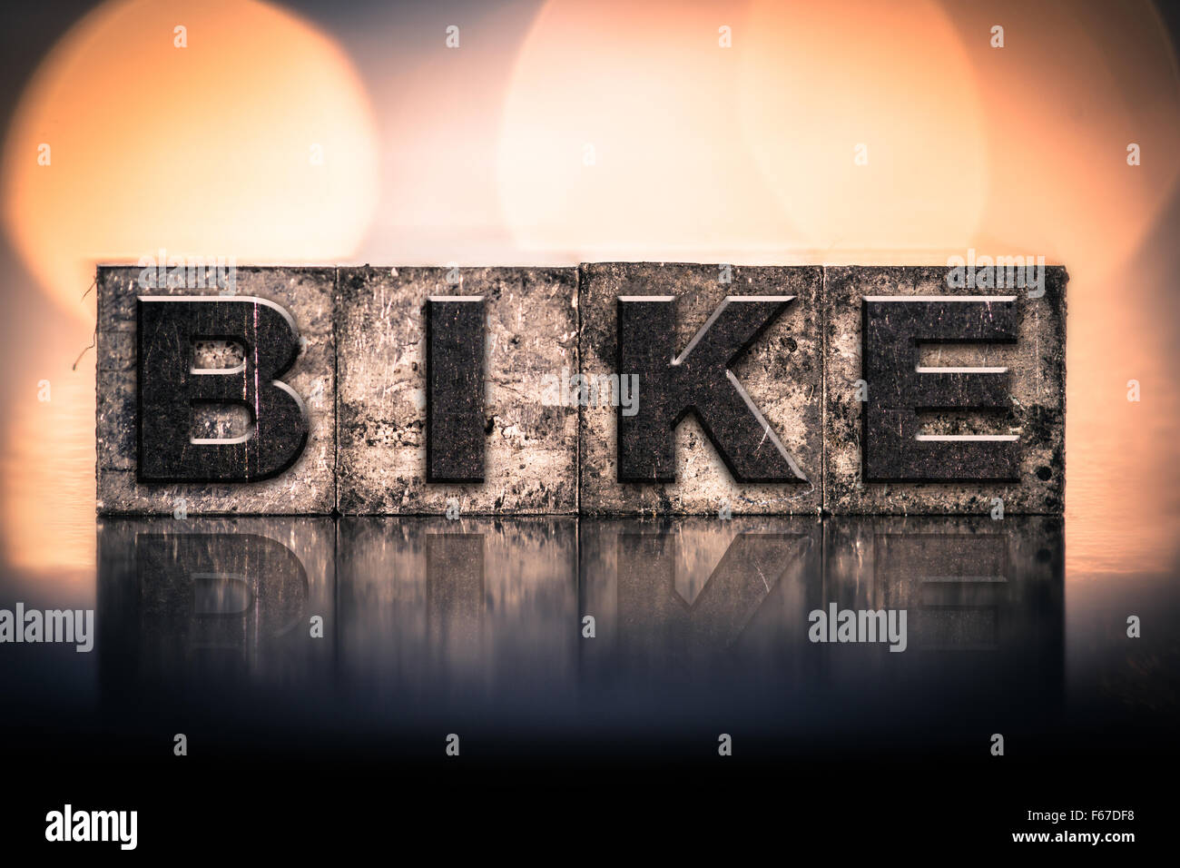 The word "BIKE" written in vintage ink stained letterpress type Stock ...