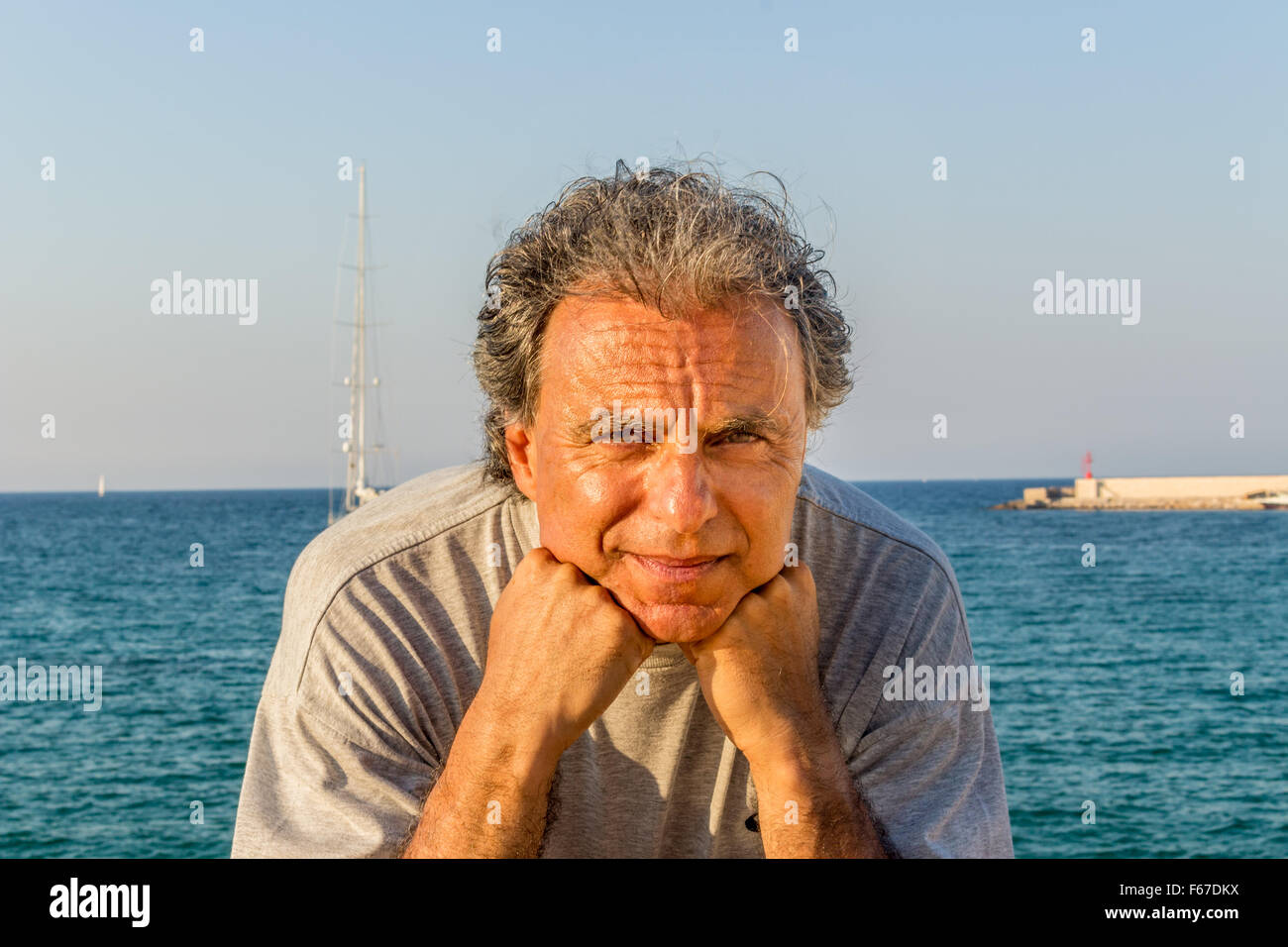 Smiling and tanned middle-aged Caucasian man relaxing on vacation ...