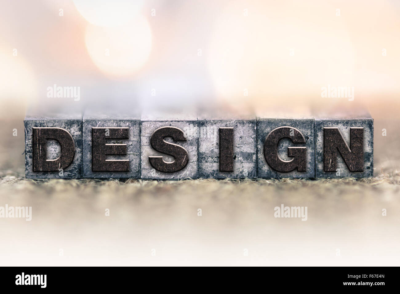 The word "DESIGN" written in vintage ink stained letterpress type Stock ...