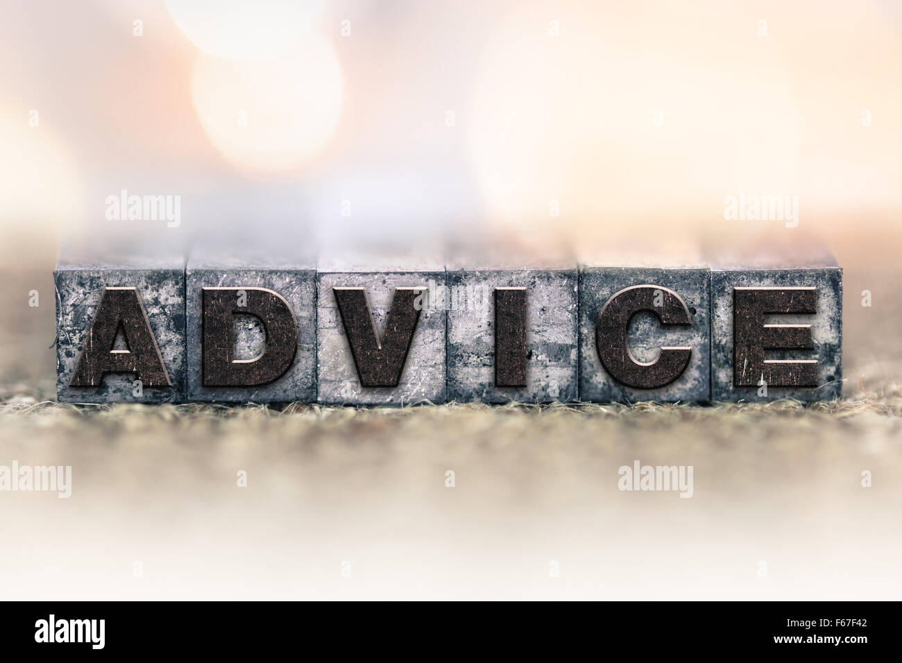 The word "ADVICE" written in vintage ink stained letterpress type Stock ...