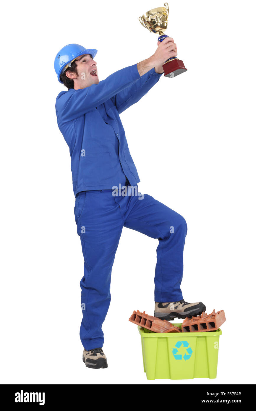 Elated tradesman celebrating his win Stock Photo - Alamy