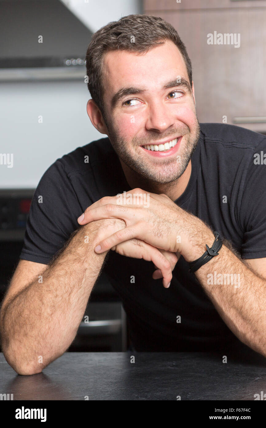 Portrait of happy young man at home Stock Photo - Alamy