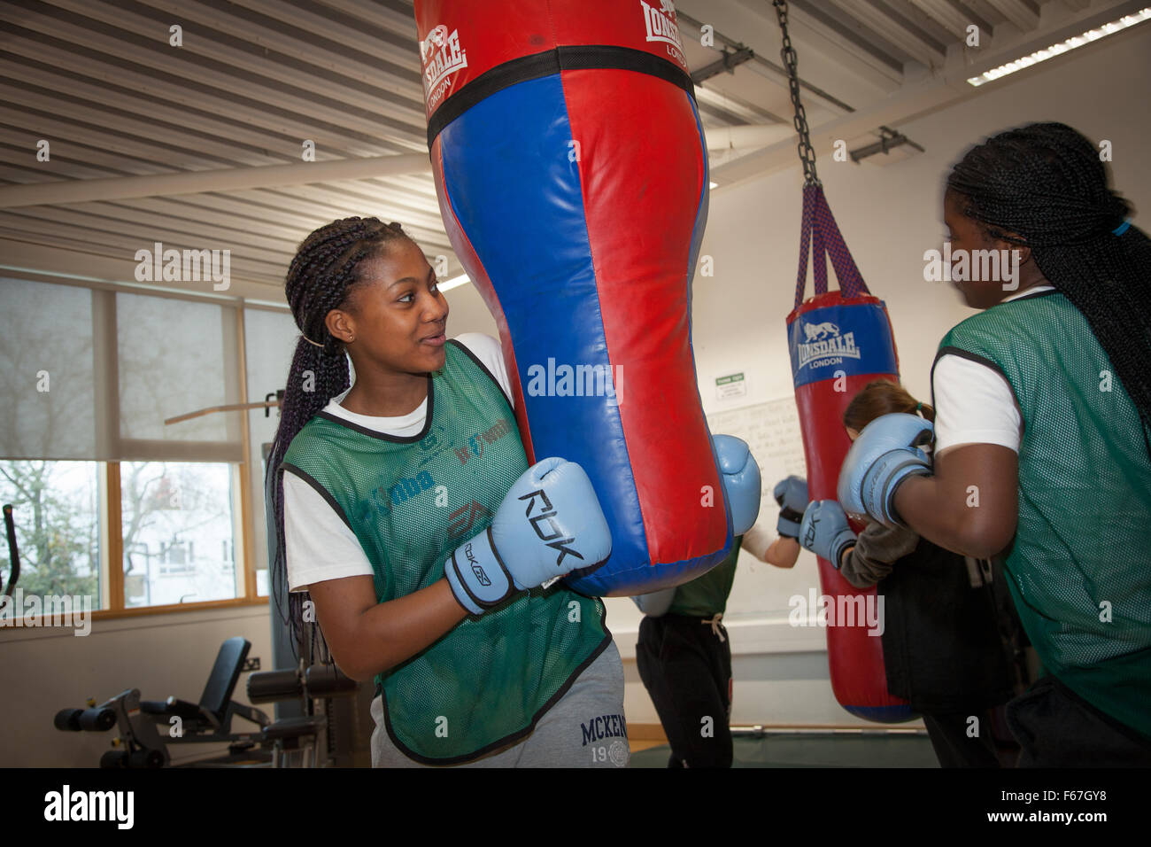 Female teenager students being coached in boxing Stock Photo - Alamy