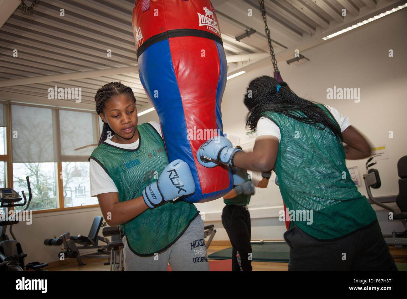 Female teenager students being coached in boxing Stock Photo - Alamy