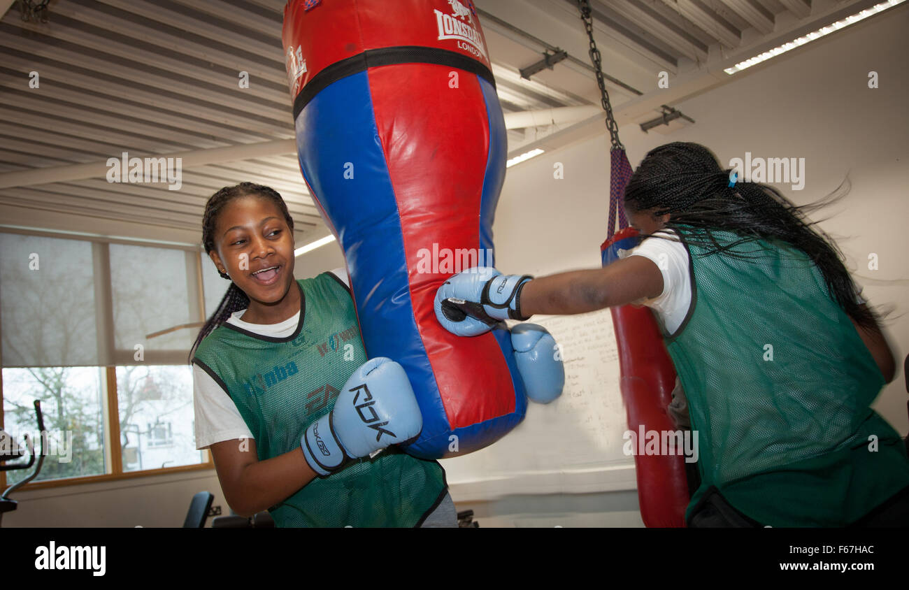 Female teenager students being coached in boxing Stock Photo - Alamy