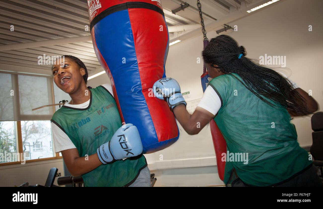 Female teenager students being coached in boxing Stock Photo - Alamy