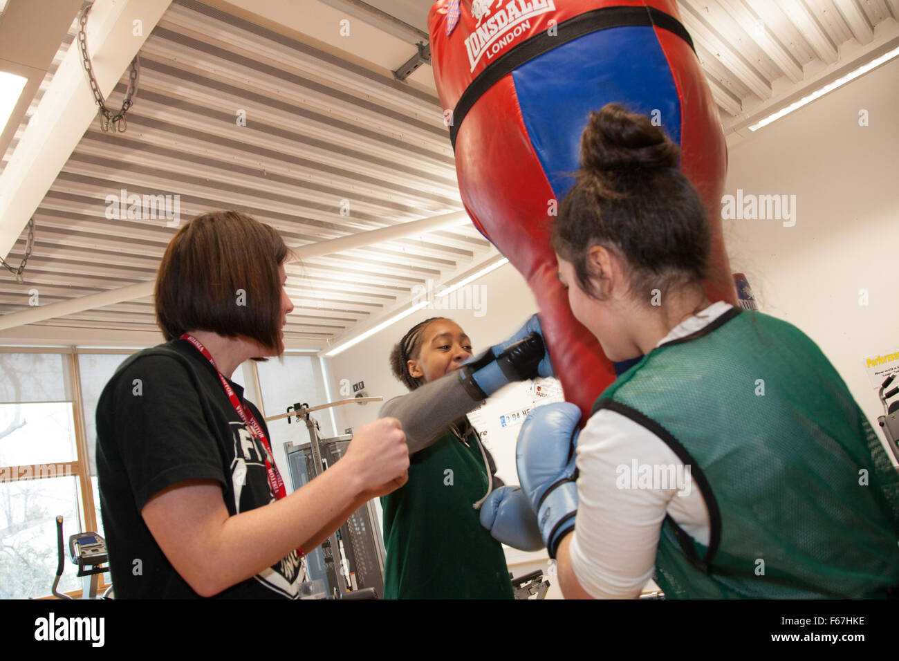 Female teenager students being coached in boxing Stock Photo - Alamy