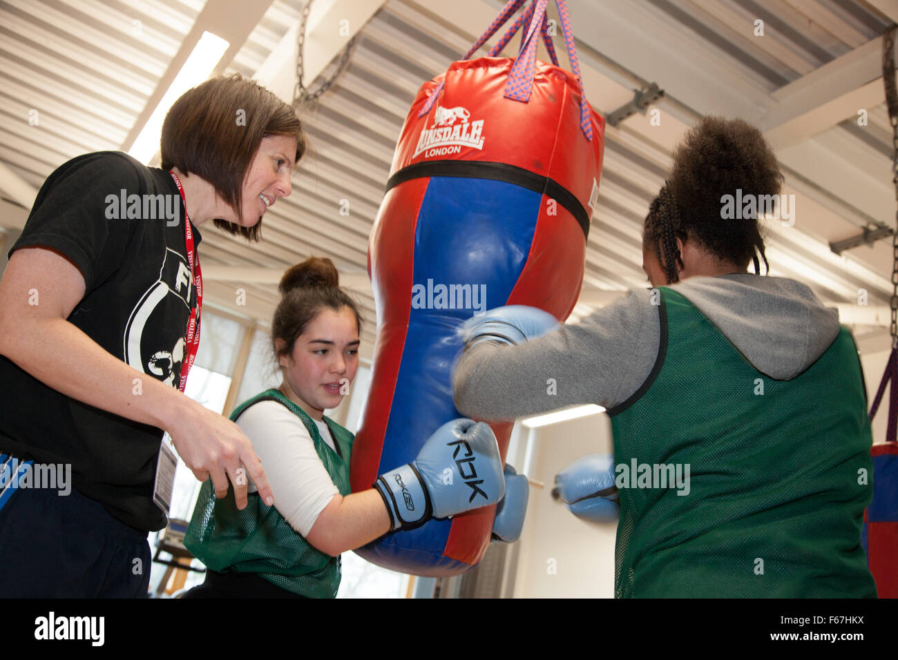 Female teenager students being coached in boxing Stock Photo - Alamy