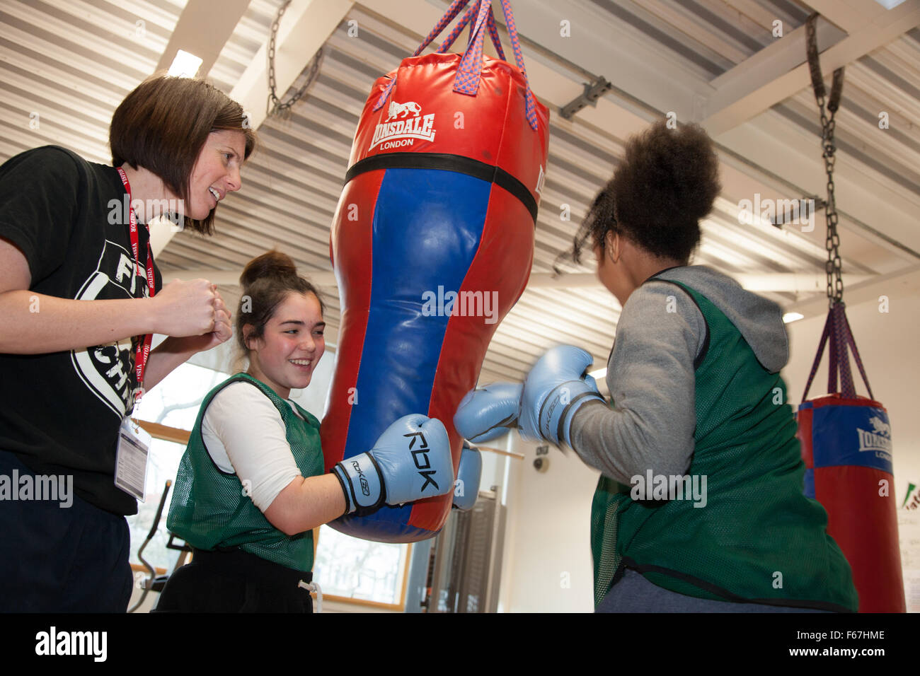 Female teenager students being coached in boxing Stock Photo - Alamy