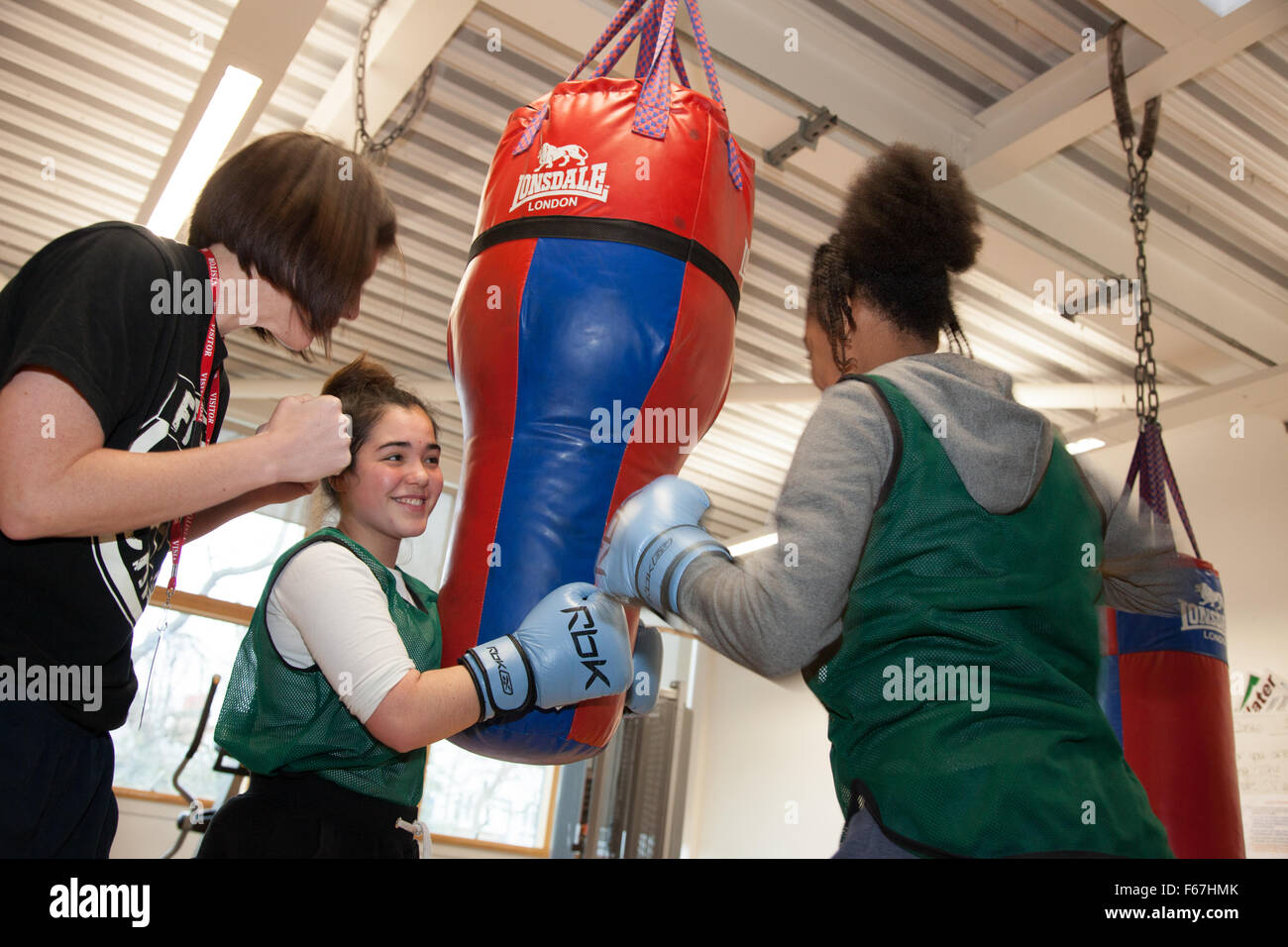 Female teenager students being coached in boxing Stock Photo - Alamy