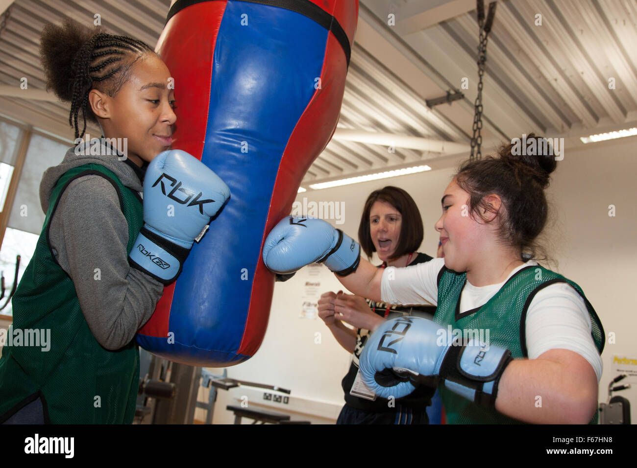 Female teenager students being coached in boxing Stock Photo - Alamy