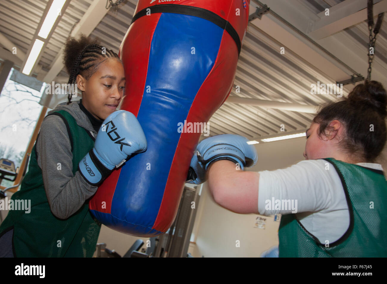 Female teenager students being coached in boxing Stock Photo - Alamy