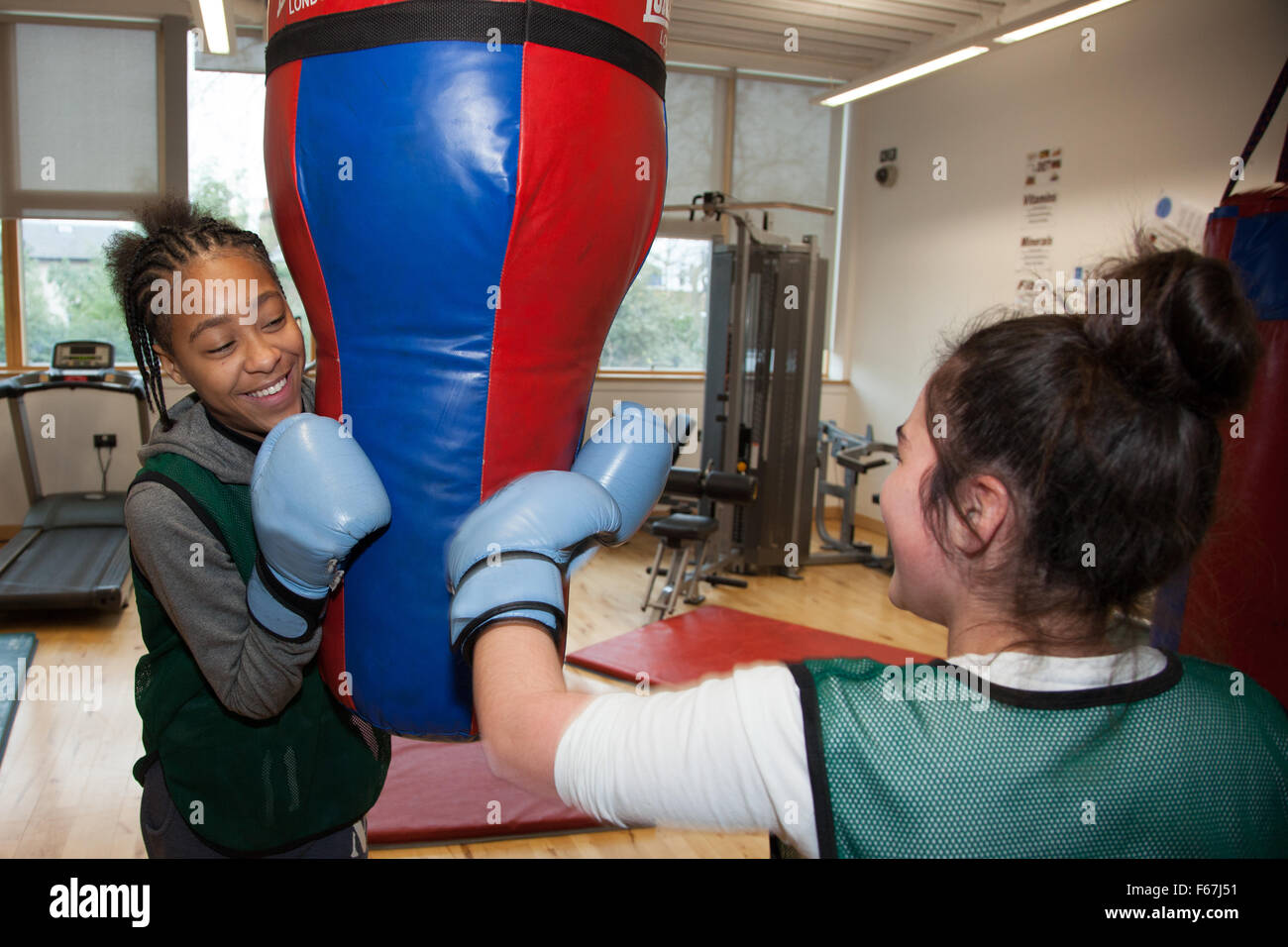 Female teenager students being coached in boxing Stock Photo - Alamy