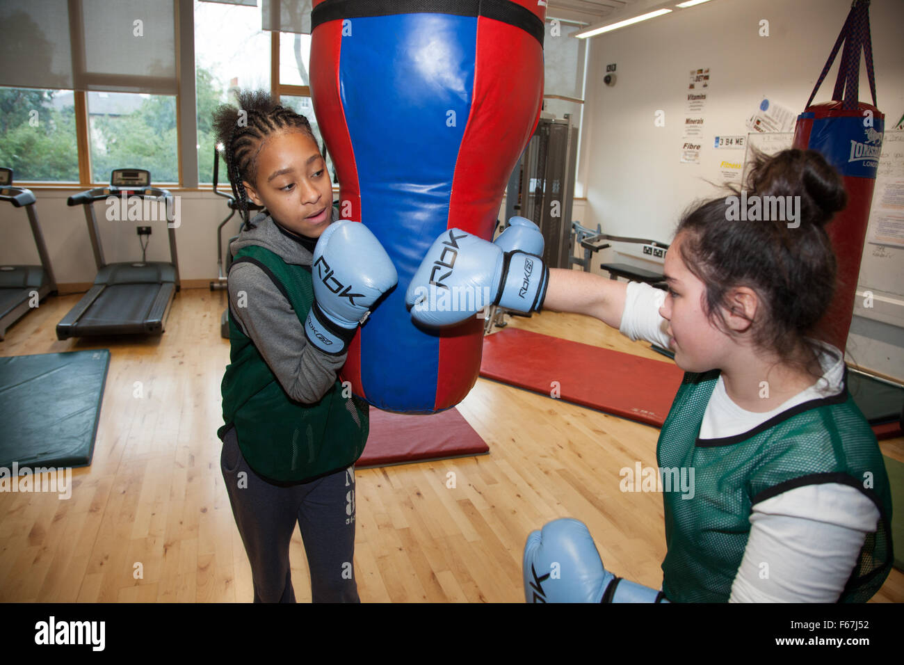 Female teenager students being coached in boxing Stock Photo - Alamy