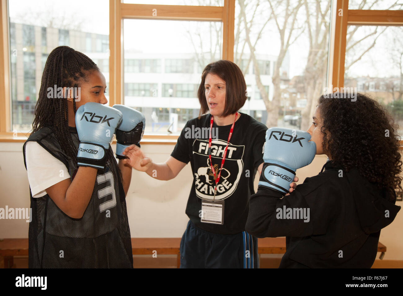 Female teenager students being coached in boxing Stock Photo - Alamy